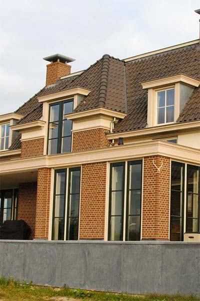 Stijlvolle gevelplinten in natuursteen | Schoot Natuursteen